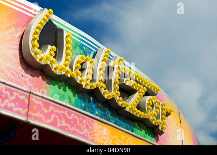 A waltzer fairground ride sign with lights Stock Photo - Alamy