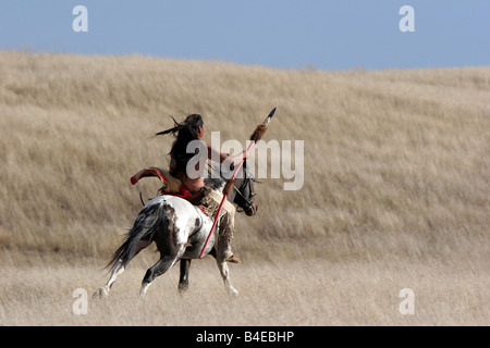 A Native American Indian with a spear riding horseback in South Stock ...