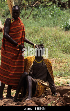 Karamojong villager having shave, Karamoja, Uganda Stock Photo - Alamy