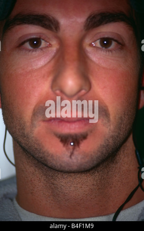 piercing in the chin Stock Photo - Alamy