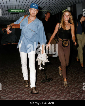 Jason Donovan Actor and Singer with girlfriend Danielle Gaha Stock ...