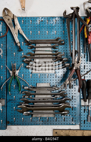 Garage tools hanging on the wall Stock Photo - Alamy