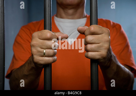 Man standing behind bars Stock Photo, Royalty Free Image: 25028186 - Alamy