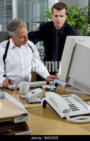 Two police officers working in an office Stock Photo - Alamy