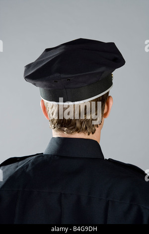 Rear view of a police officer Stock Photo - Alamy