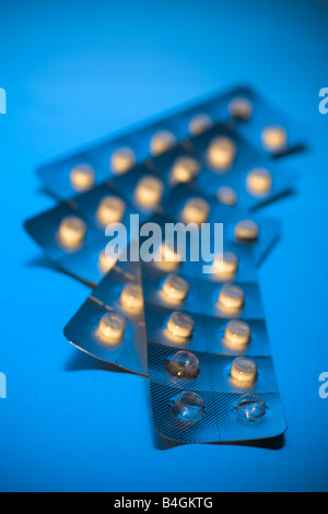 Blue pills in strip Stock Photo - Alamy