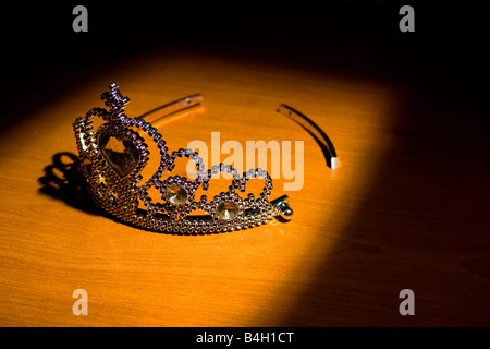 A broken tiara in a rectangular spotlight Stock Photo - Alamy