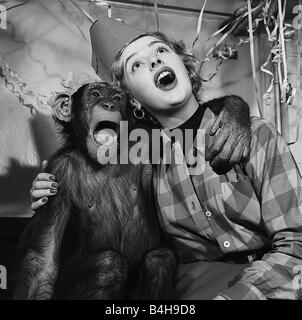 Actress Jill Adams attends a chimps Christmas party 1955 Stock Photo ...
