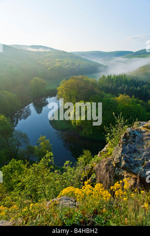 A vertical shot of a river flowing through Fjadrargljufur Canyon in ...