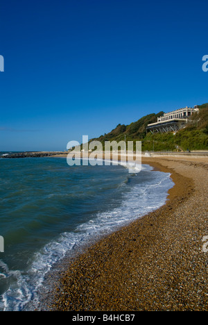 Inshore waves and clear water on white sandy beach with sun reflection ...