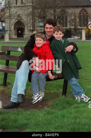 Dominic Taylor actor with his sons Arthur 6 in red coat and Jack 7 in ...