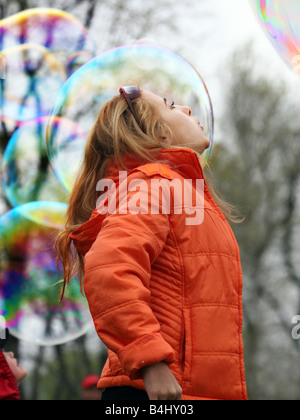 pretty teen girl floating in an inflatable raft on a lake in haliburton ...