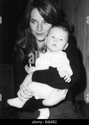 Charlotte Rampling at Heathrow Airport with her son Barnaby and husband ...