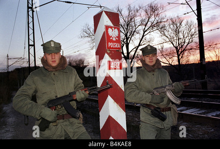 Polish border guard officers with guns on a night patrol at the Polish ...