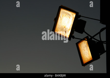two security lights on building side wall at night Stock Photo - Alamy