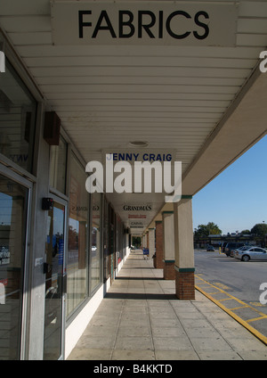 A typical strip mall, strip center, strip centre, or strip plaza, is a ...