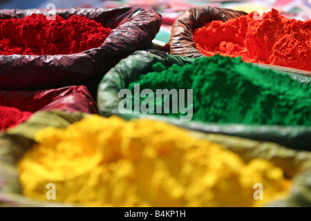 a stall selling Holi paints and dyes at an Indian Market. Photographed ...