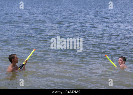 Children playing Water battle, water game battle Stock Photo - Alamy