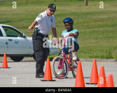 Female Police and Community Safety Officer or PCSO on duty directing ...