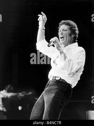 Tom Jones singer dancing in front of fireplace Stock Photo - Alamy
