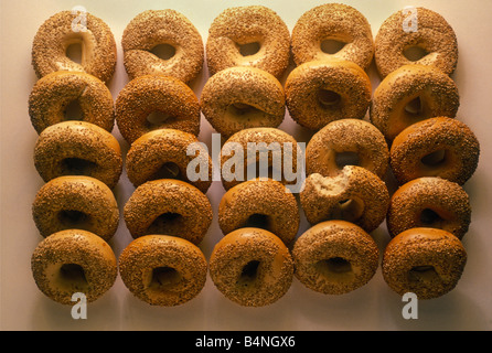 one bitten bagel stack rows Stock Photo - Alamy