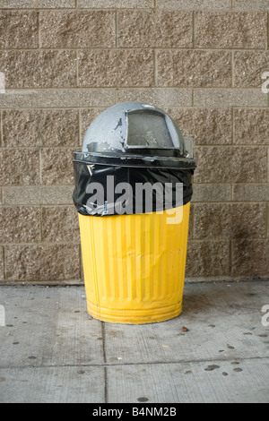 Dented trash can Stock Photo - Alamy
