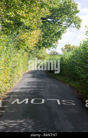 'Slow' road markings Stock Photo - Alamy
