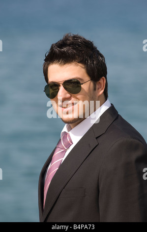Portrait of young muslim man wearing traditional clothes Stock Photo ...