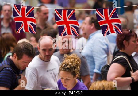 Union Jack bunting Union Jack flags with crowd of people browsing ...