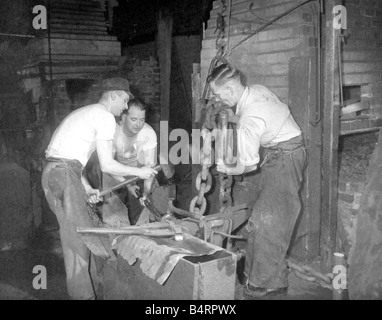Chain making is a hot slogging job but three who are used to the work ...