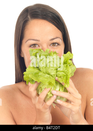 Woman covering her face with lettuce Stock Photo - Alamy