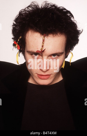 Adam Ant the 1980s British pop singer leans against tree Stuart Stock ...