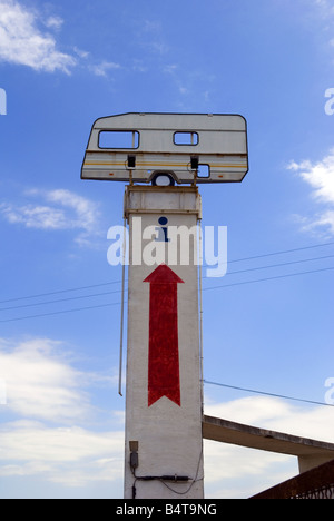 Entrance sign with large blue arrow pointing the way Stock Photo - Alamy