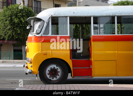 An old bright yellow Maltese bus waits at Marsaskala bus station in ...