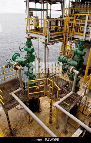Well head area of offshore oil and gas production marine rig off coast ...