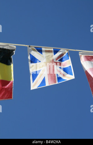 old faded union jack flag flying in wind in sun Stock Photo - Alamy