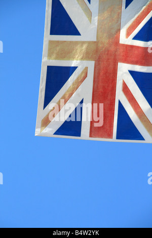 Old faded bunting with Union Jack flag wave in the winter winds faded ...
