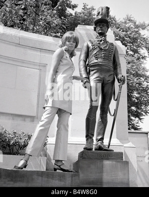 Model Bo Bo White modelling a trouser suit which becomes a mini dress ...