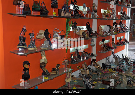Various womens shoes on display in store Stock Photo - Alamy