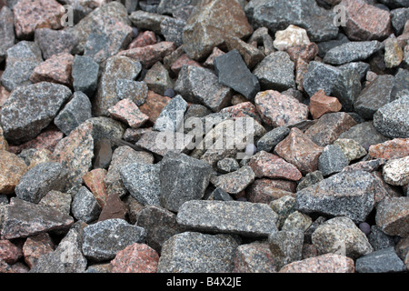 Stones and rocks in the railroad bed between the rails with iron ore ...
