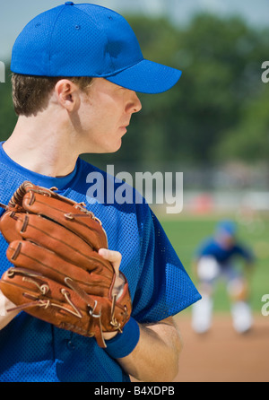 Baseball, pitch and team sports of a man pitcher busy with teamwork ...