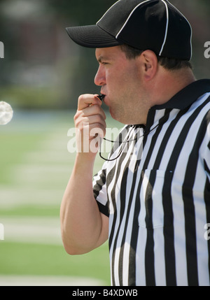 Close up of a referee blowing a whistle Stock Photo - Alamy