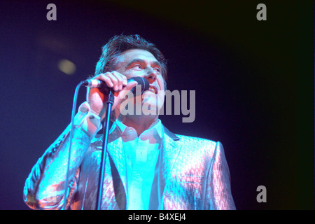 Bryan Ferry Singer with Pop Group Roxy Music singing on stage wearing ...