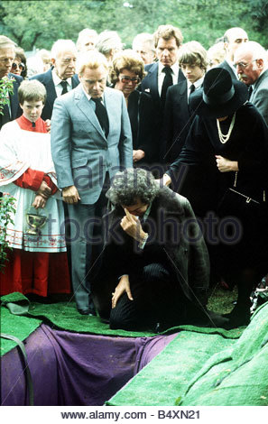 Alan Lake with son Jason at funeral of Diana Dors 1984 during service ...