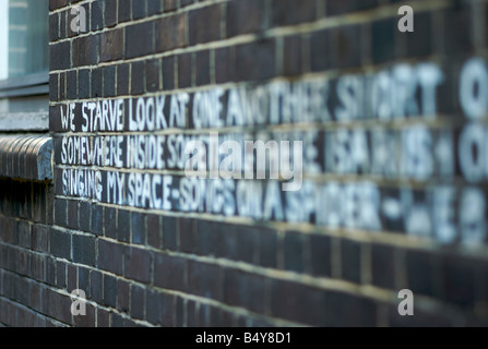 Graffiti poetry on a brick wall in London Stock Photo - Alamy