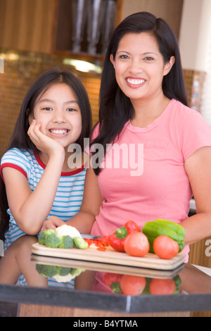 Mother and daughter cooking dinner in a kitchen Stock Photo - Alamy