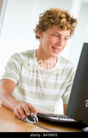 Teenage Boy Using Desktop Computer Stock Photo - Alamy