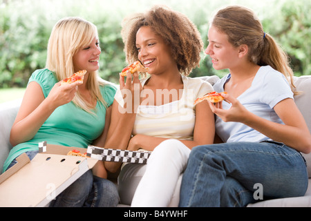 Eating Fast Food. Happy three Beautiful Friends Laughing, Eating Pizza ...