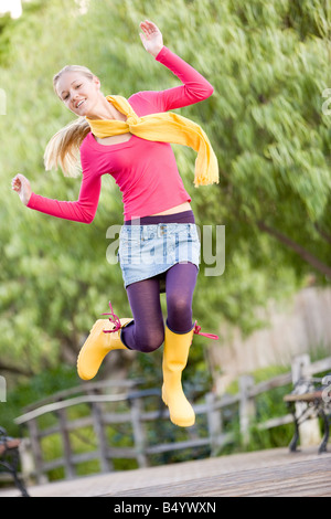 Teenage Girl Frolicking Outdoors Stock Photo - Alamy