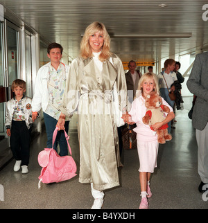Kelly Emberg wife of Rod Stewart with daughter Ruby at Heathrow leaving ...